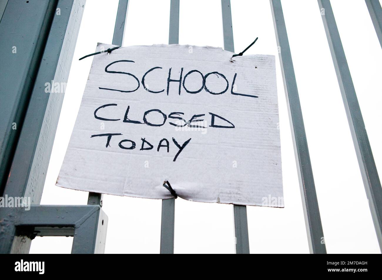 A hand dwritten notice on a school declaring the schjool to be closed ...