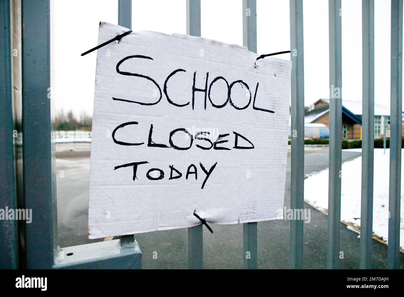 A hand dwritten notice on a school declaring the schjool to be closed ...