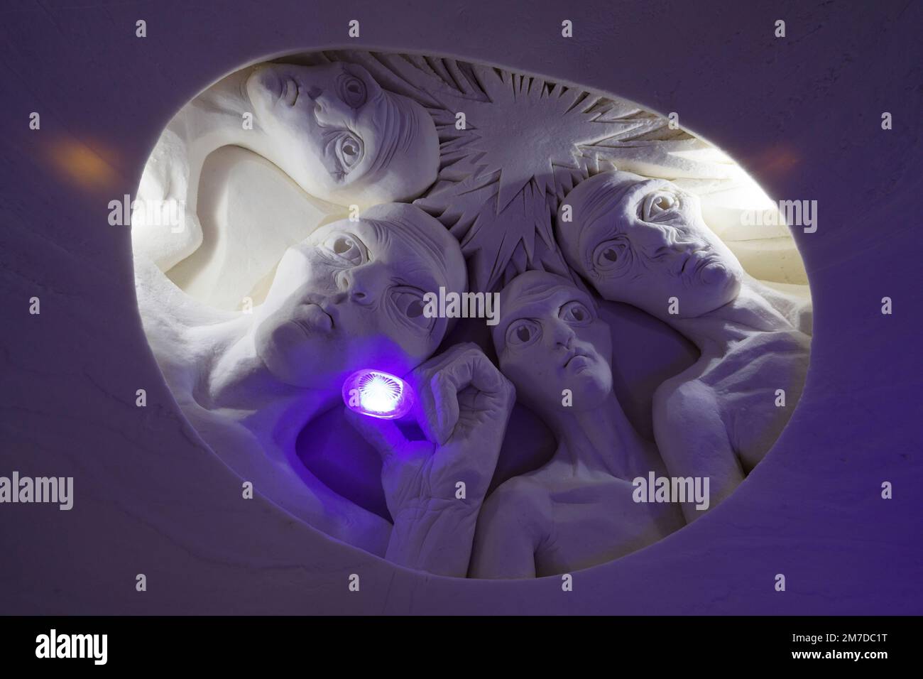 Ice sculptures representing alien faces on the ceiling of an hotel room ...