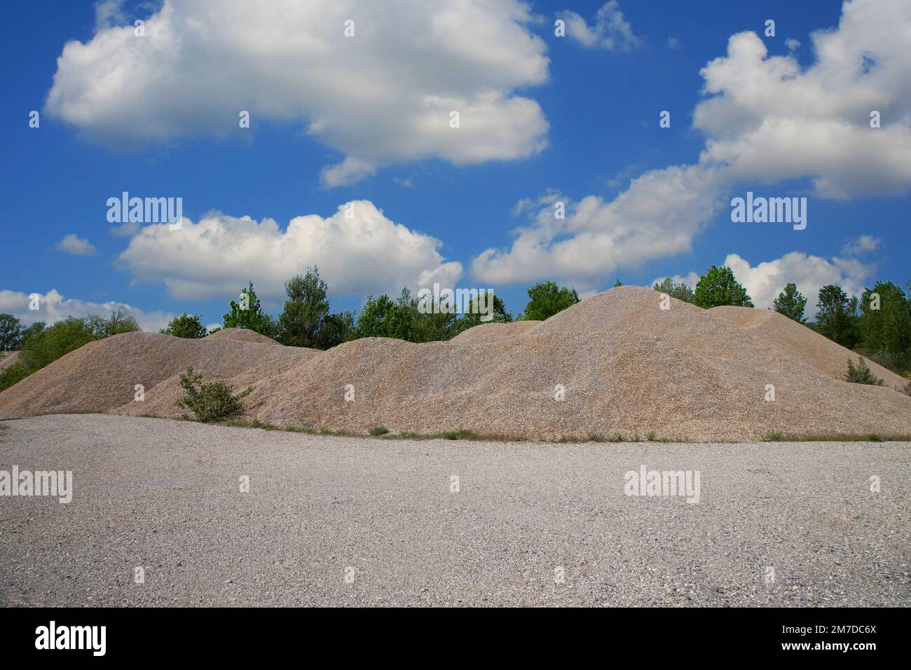 Gravel deposit construction landscape with clouds Stock Photo - Alamy