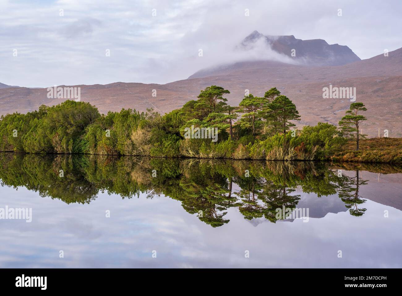Loch Cul Dromannan reflections, with summit ridge of Ben More Coigach ...