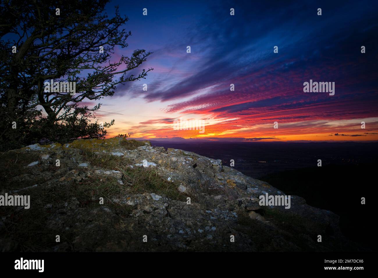 Sunset over Cheltenham, Gloucestershire from the top of a hill ...
