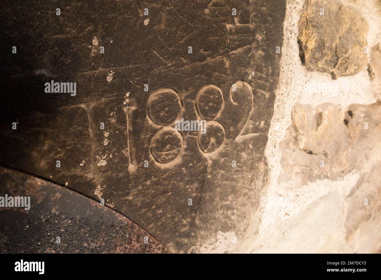 Details, including 1880 date carved into the wall, inside a four banal ...