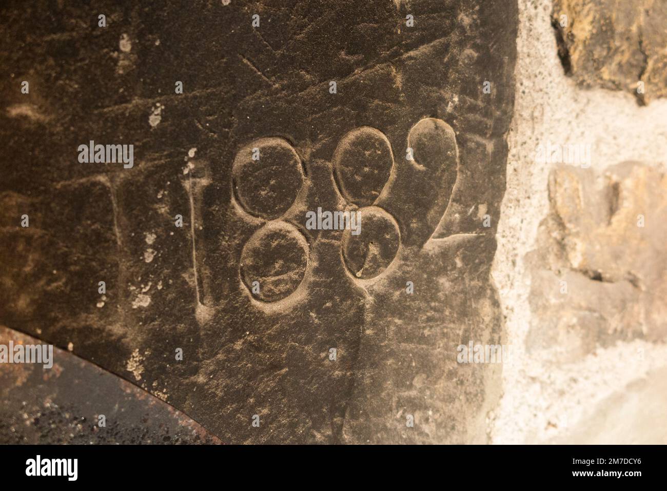 Details, including 1880 date carved into the wall, inside a four banal ...