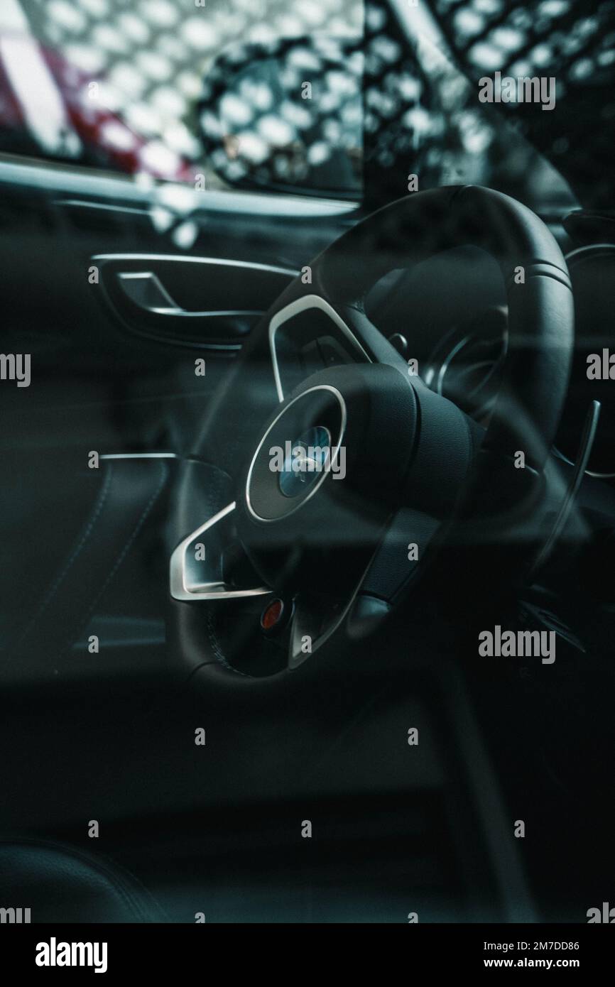 A vertical closeup shot of the details and logo of the stirring wheel ...