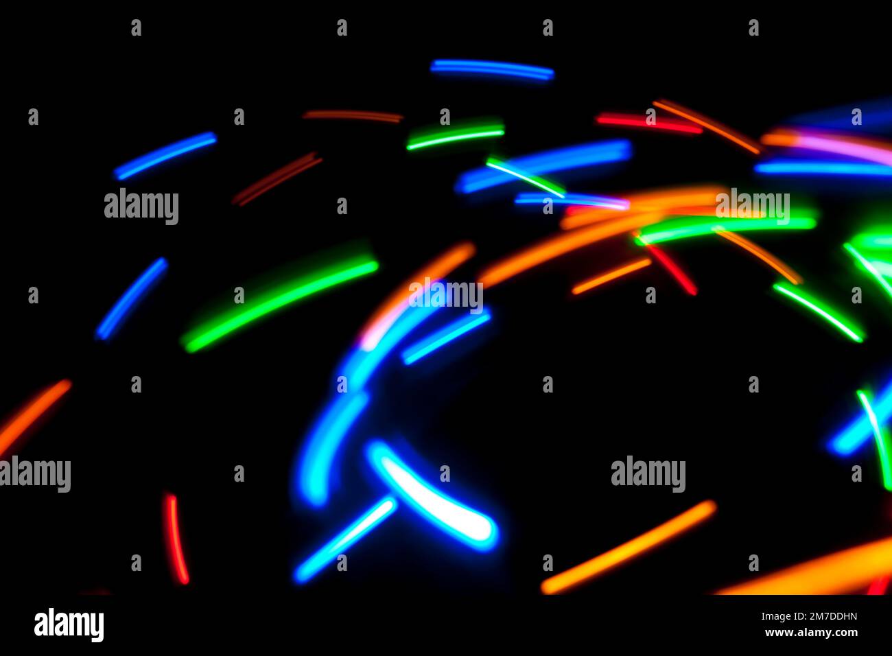 Abstract swirls and patterns of light caused by a spining multicoloured ...