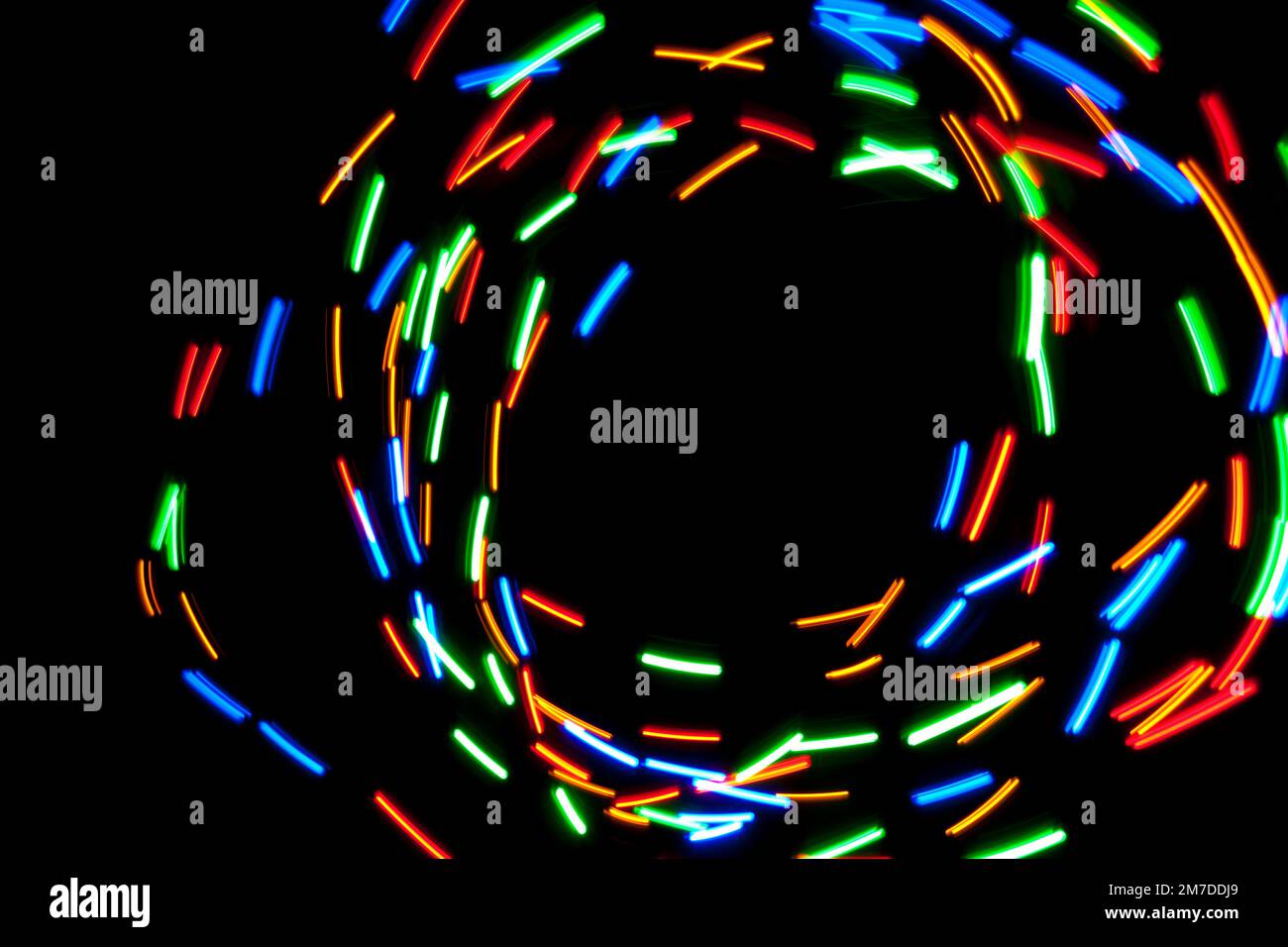 Abstract swirls and patterns of light caused by a spining multicoloured ...