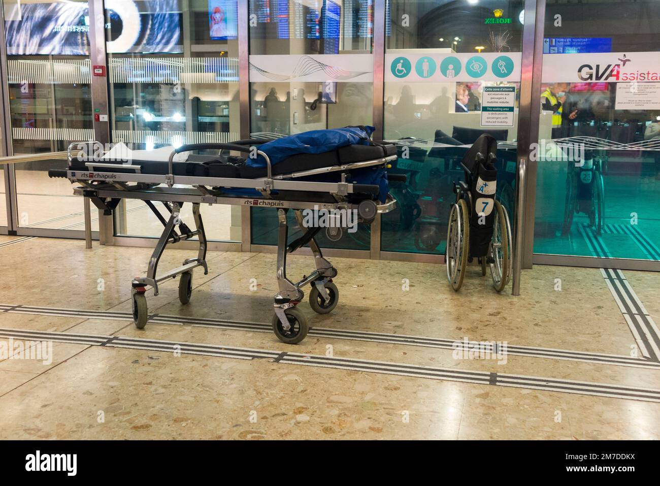 Gurney stretcher and wheelchair on standby to assist passengers ...