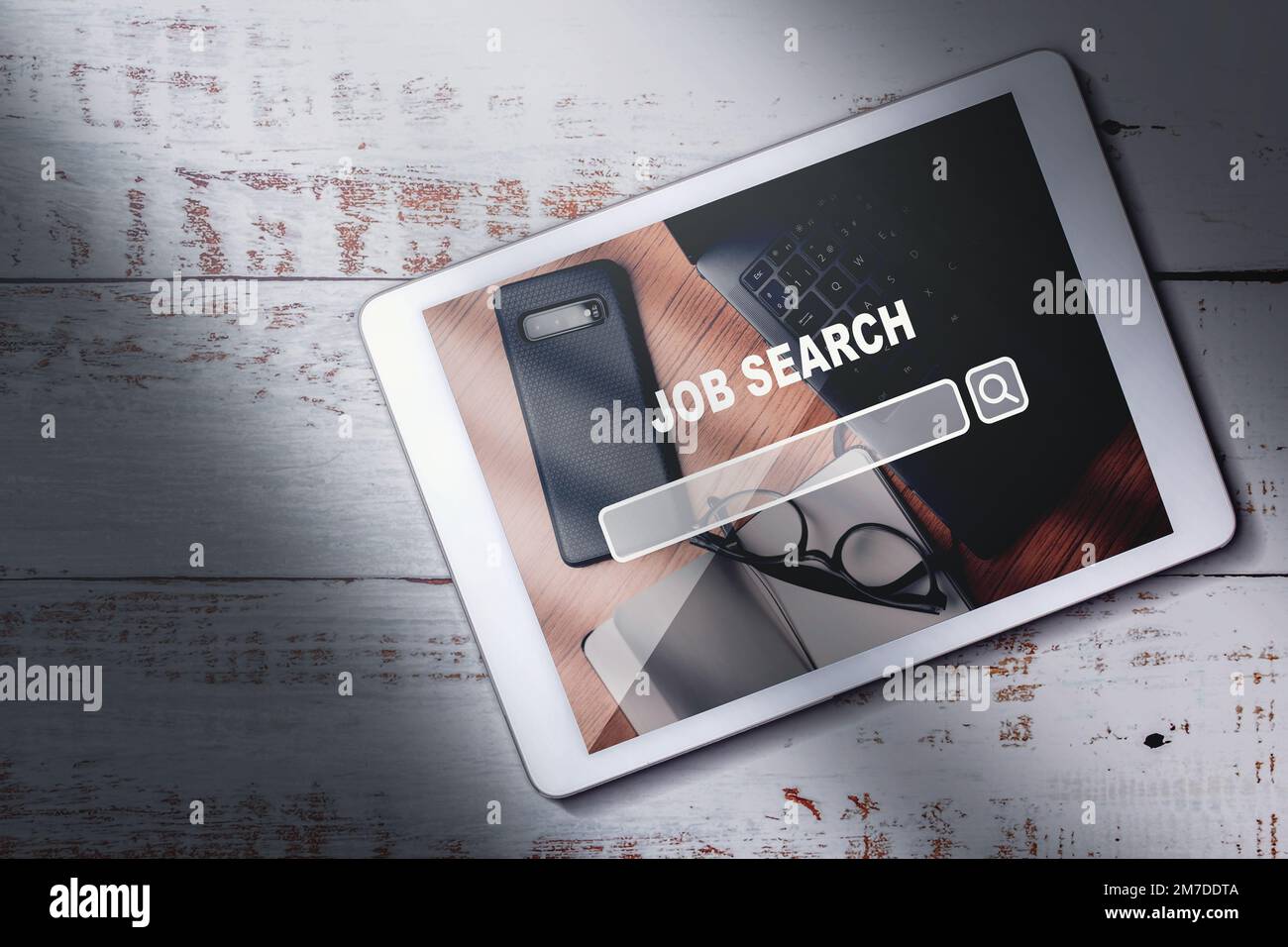 Top view of digital tablet with search job title on screen. Find your ...