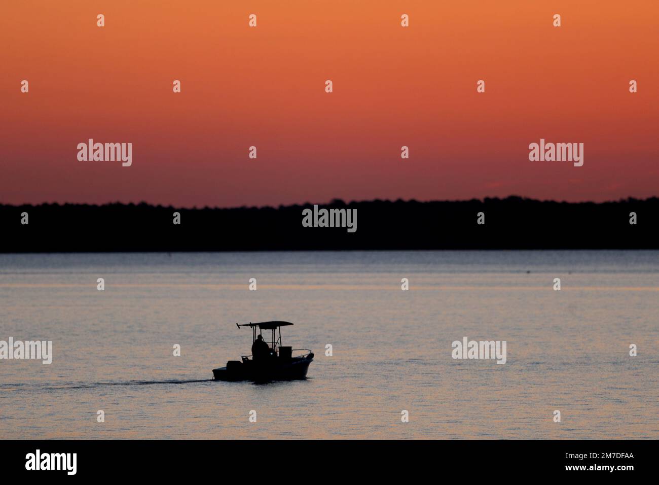 FILE - A small boat travels along the Honga River near the Chesapeake ...
