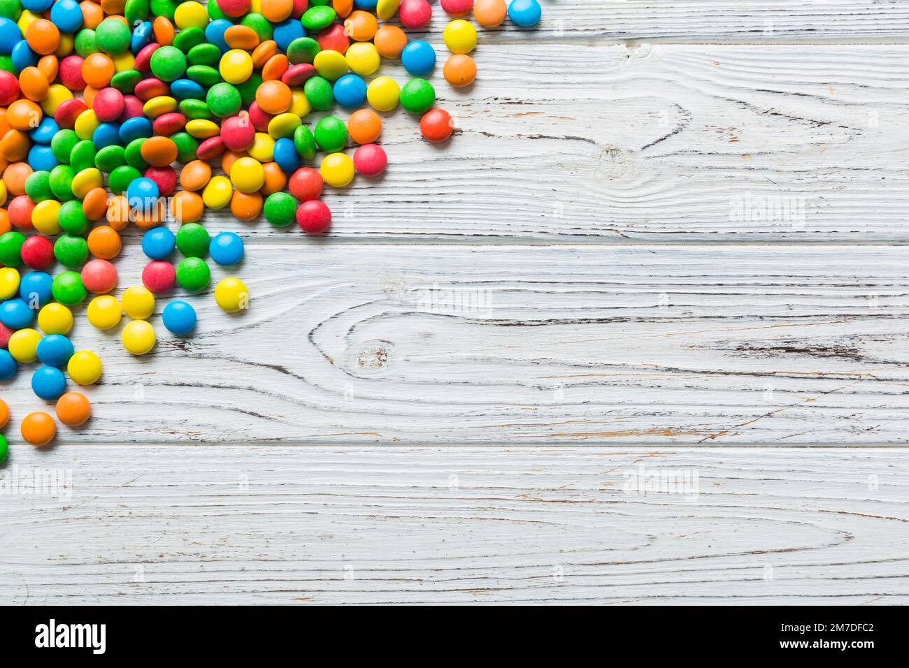 Mixed collection of colorful candy, on colored background. Flat lay ...