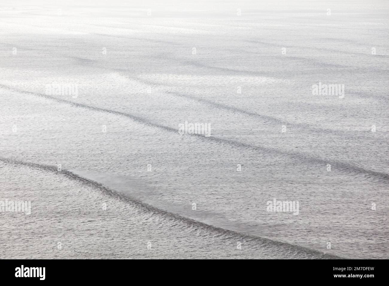Lines of surf or swell enter the bay at Saunton sands Devon where ...