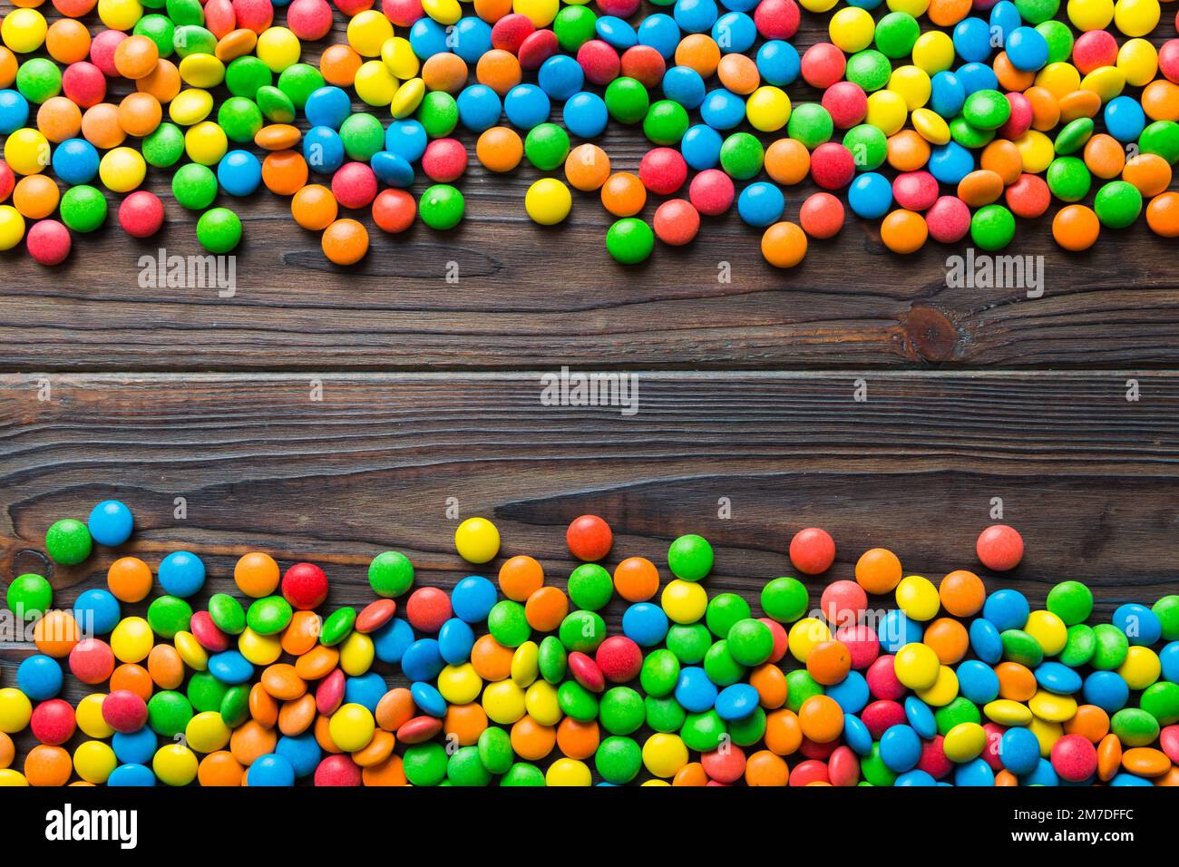 Mixed collection of colorful candy, on colored background. Flat lay ...