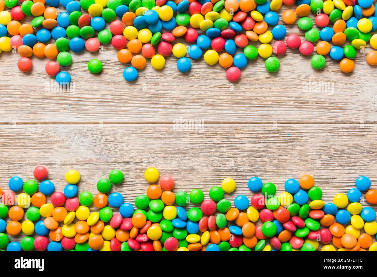 Mixed collection of colorful candy, on colored background. Flat lay ...
