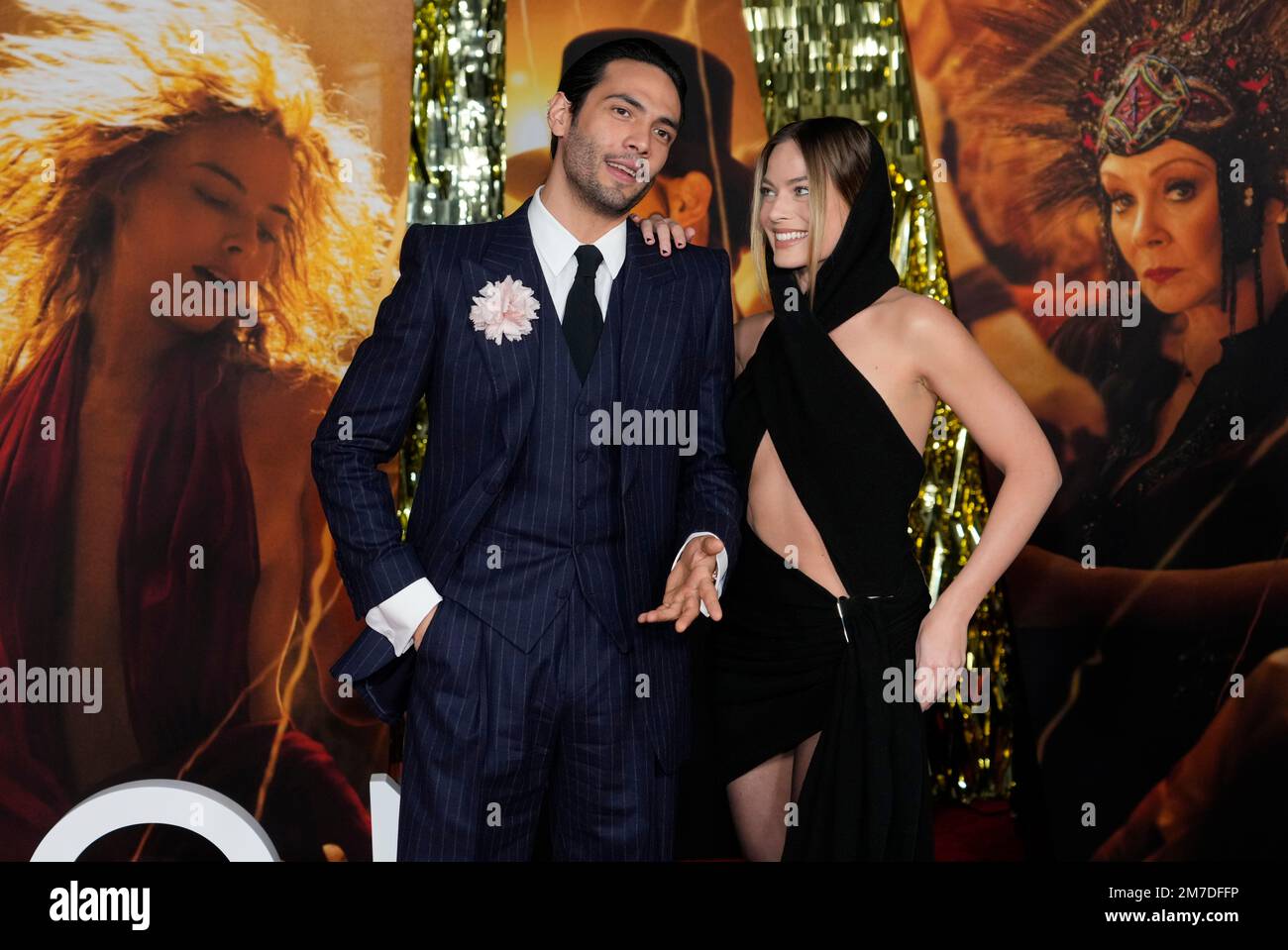 Diego Calva, left, and Margot Robbie pose together at the premiere of ...