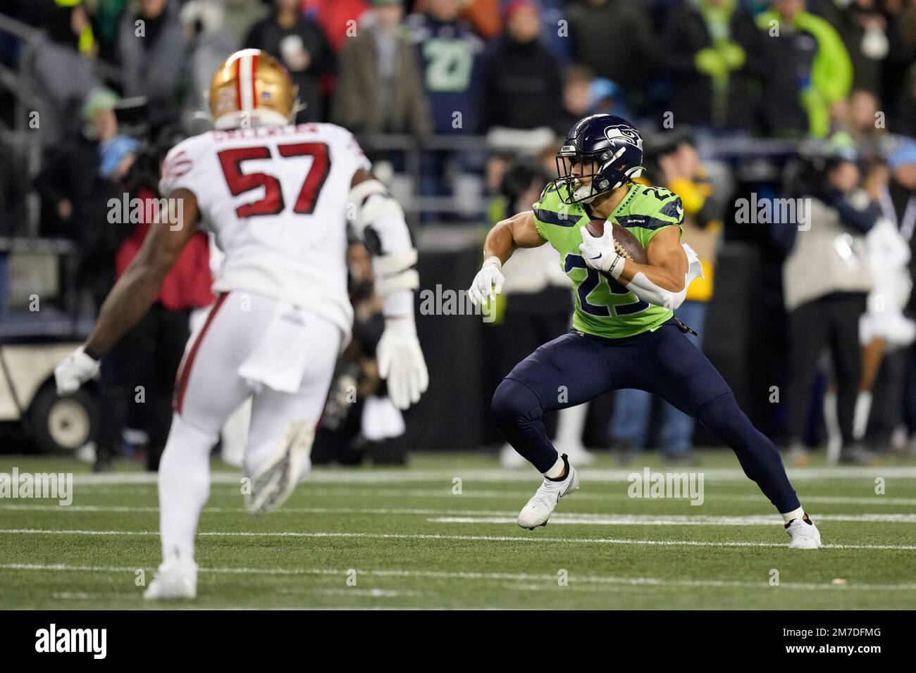 Seattle Seahawks running back Travis Homer (25) runs with the ball ...