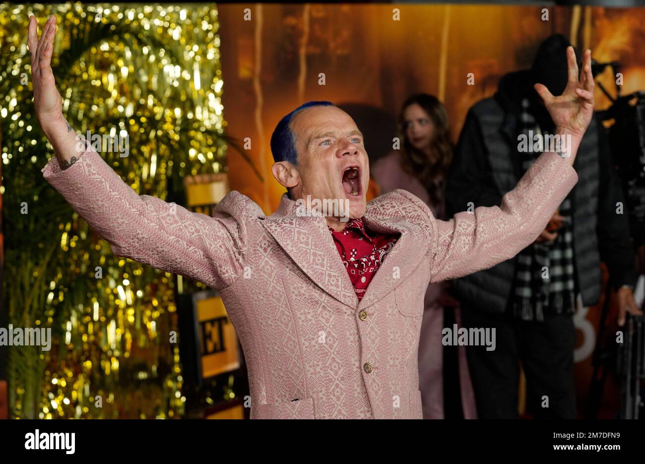 Flea, a cast member in "Babylon," strikes a pose for photographers at ...