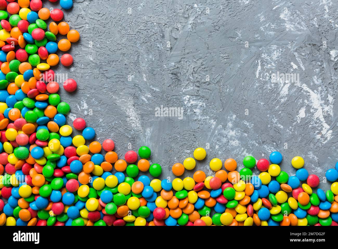 Mixed collection of colorful candy, on colored background. Flat lay ...