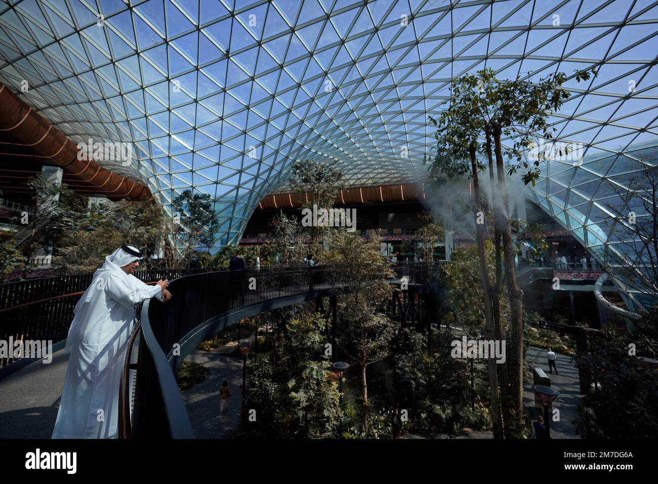 FILE - A Qatari man films new central concourse terminal expansion new ...
