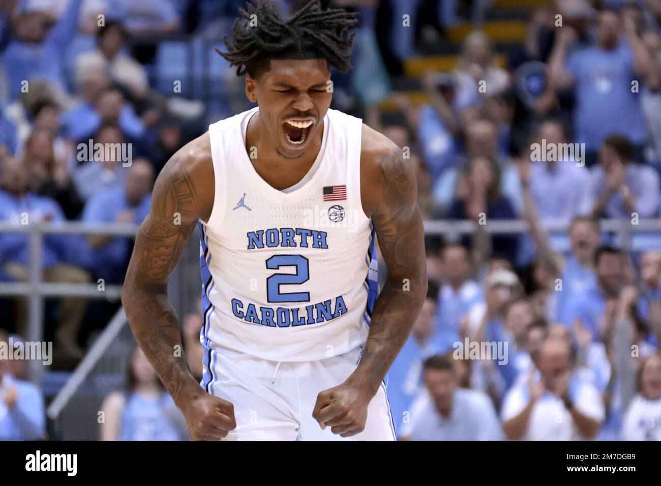 North Carolina guard Caleb Love (2) celebrates after he scored against ...