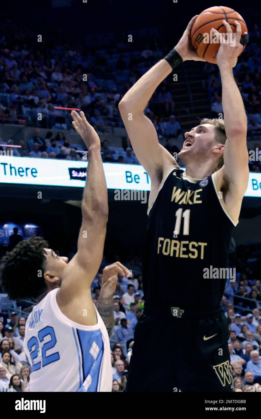 Wake Forest forward Andrew Carr (11) shoots over North Carolina forward ...