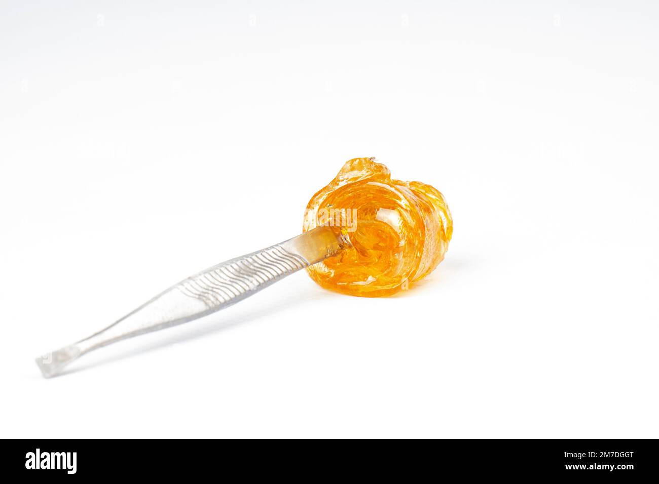 cannabis gold live resin on dab stick with high thc isolated on white ...