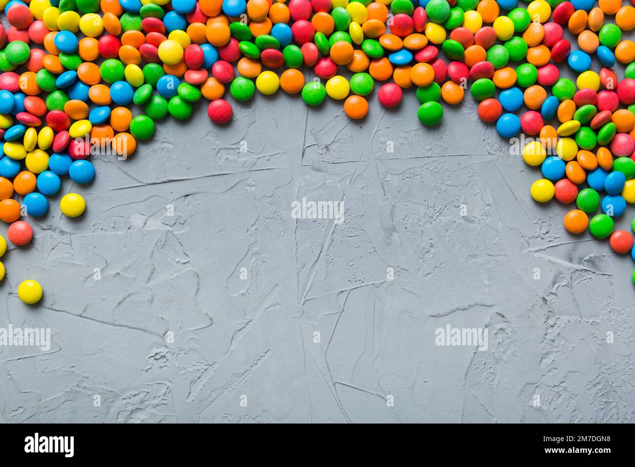 Mixed collection of colorful candy, on colored background. Flat lay ...