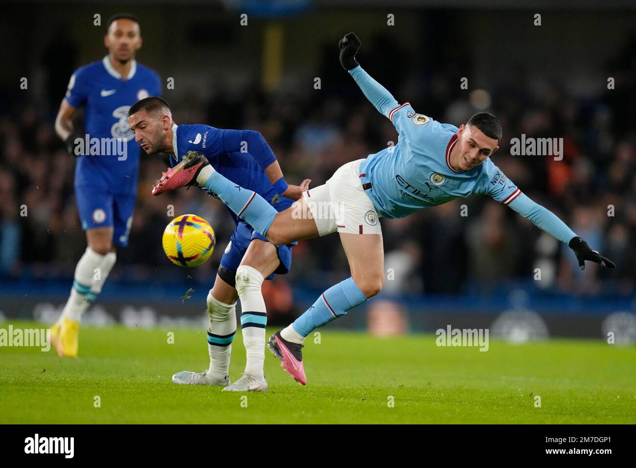 Manchester City's Phil Foden, right, and Chelsea's Hakim Ziyech, centre ...