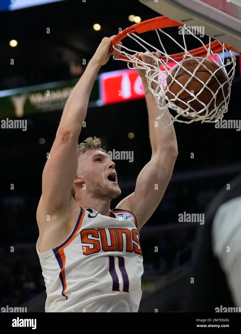 Phoenix Suns center Jock Landale (11) dunks during the second half of an NBA basketball game ...