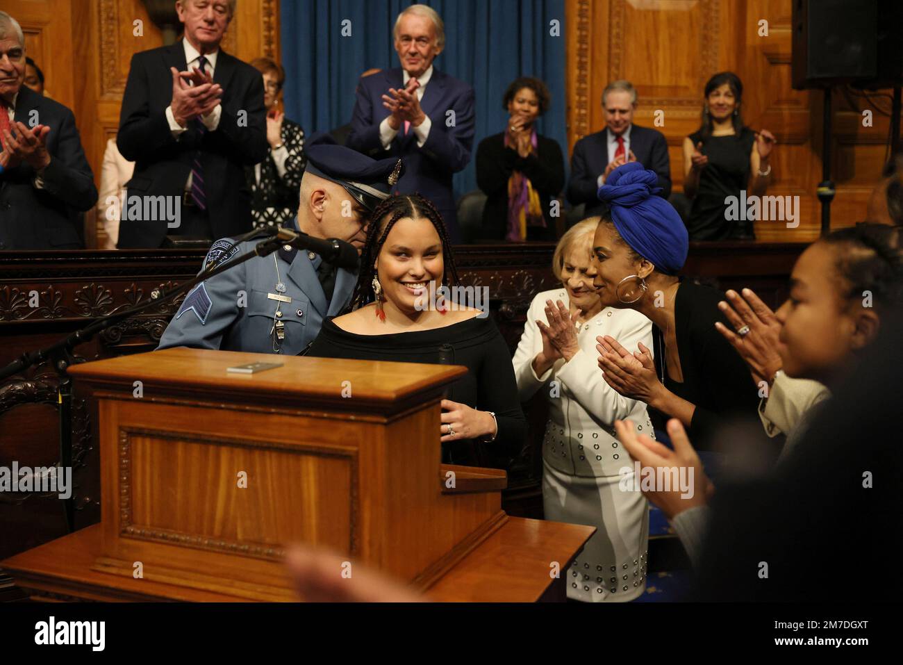 Precious Perez, center, is applauded after performing during Governor ...