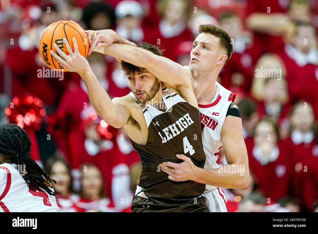 Wisconsin's Carter Gilmore (14) reaches in on Lehigh's Reed Fenton (4 ...