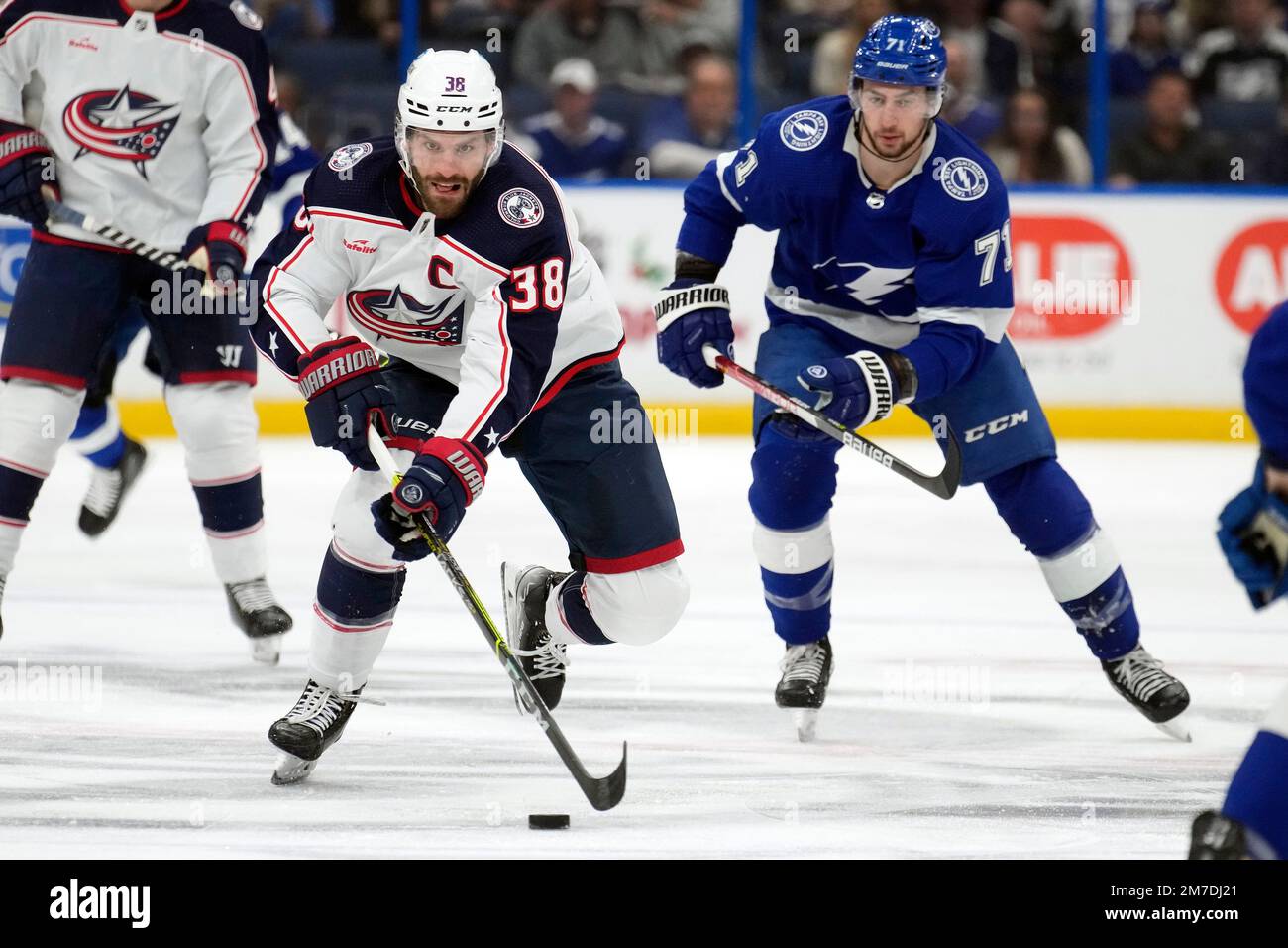 Columbus Blue Jackets center Boone Jenner (38) breaks out ahead of ...