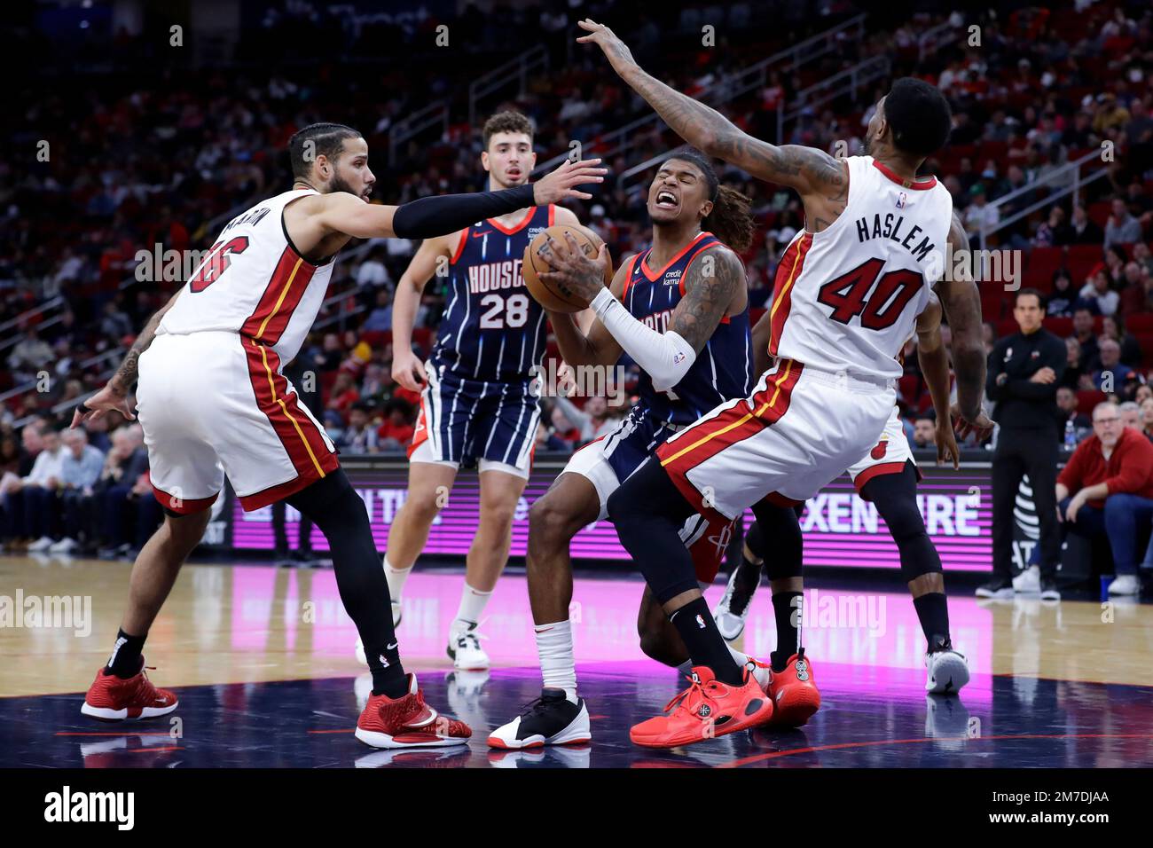 Miami Heat forward Caleb Martin, left, attempts to block as Houston ...