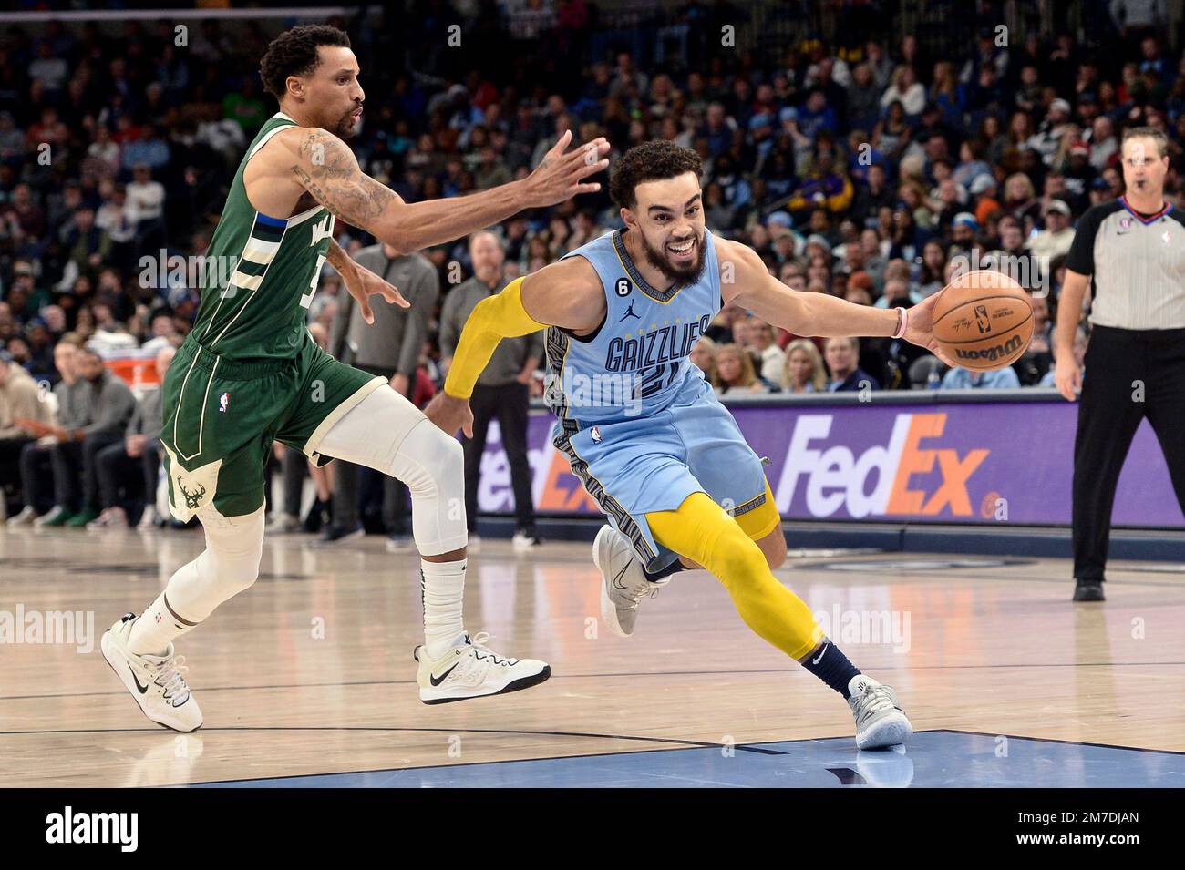 Memphis Grizzlies guard Tyus Jones (21) drives ahead of Milwaukee Bucks ...