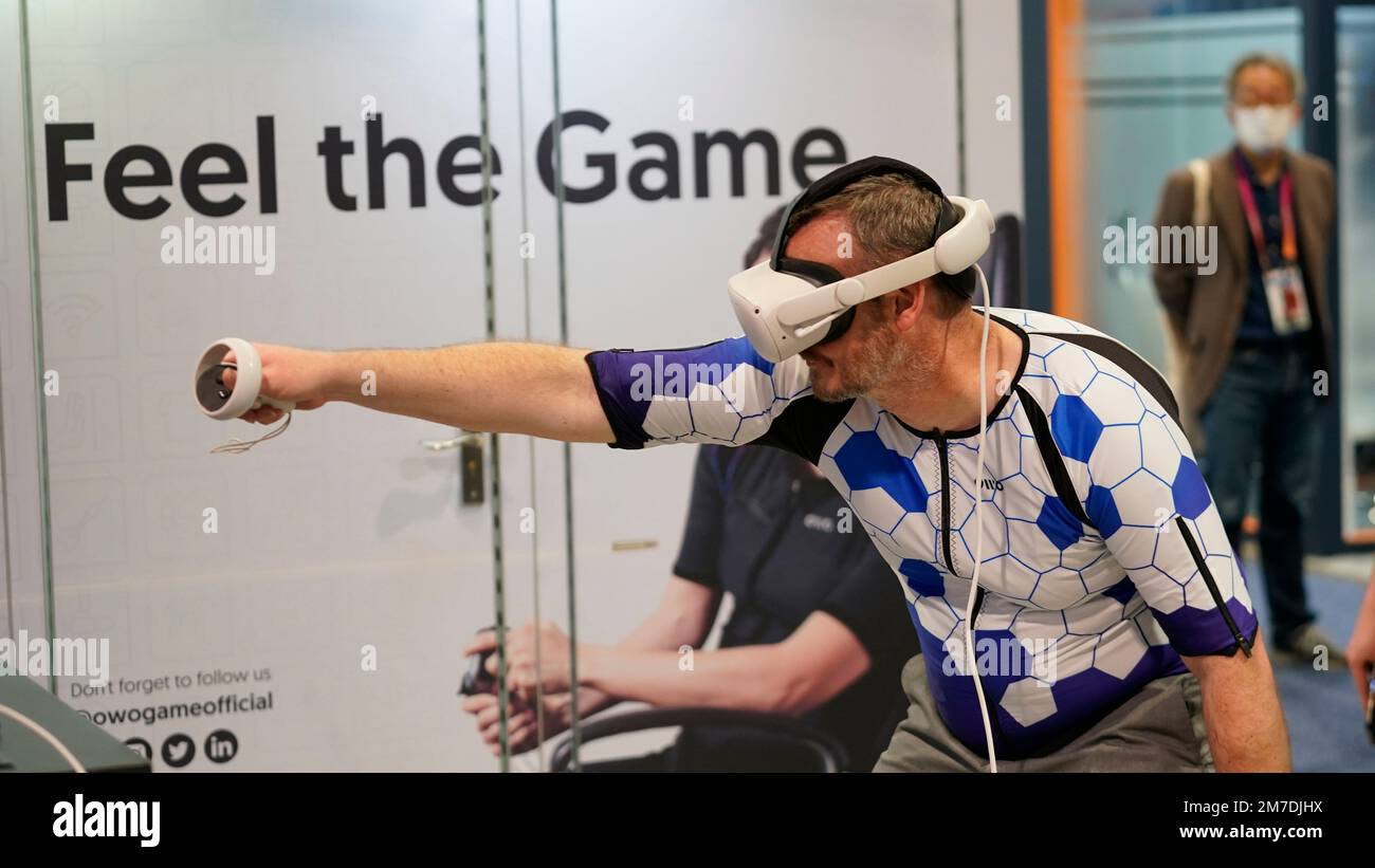 The OWO second skin is worn by a video player at the OWO booth during ...