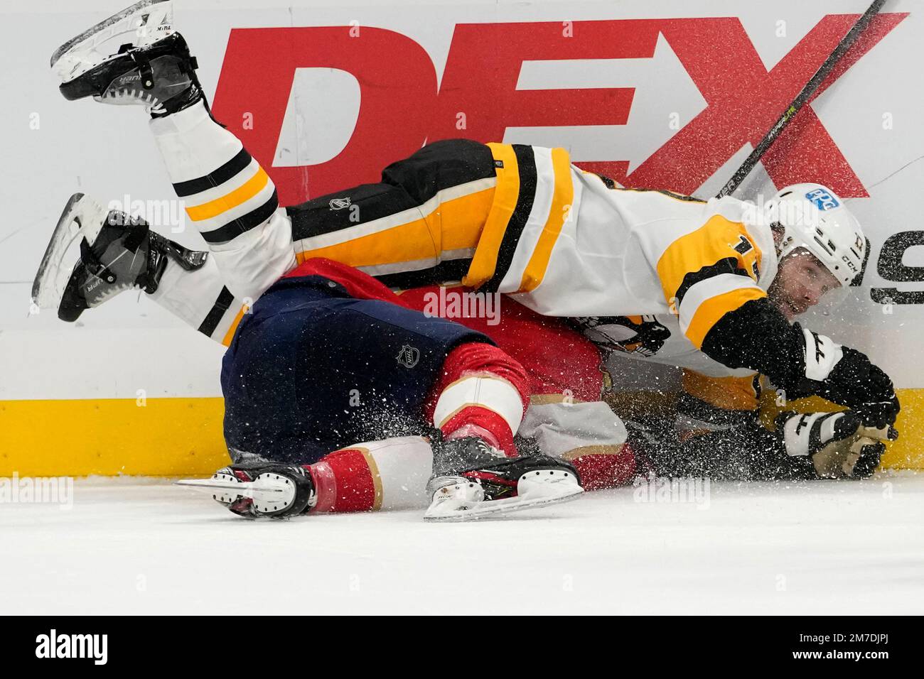 Pittsburgh Penguins right wing Bryan Rust (17) falls on top of Florida ...