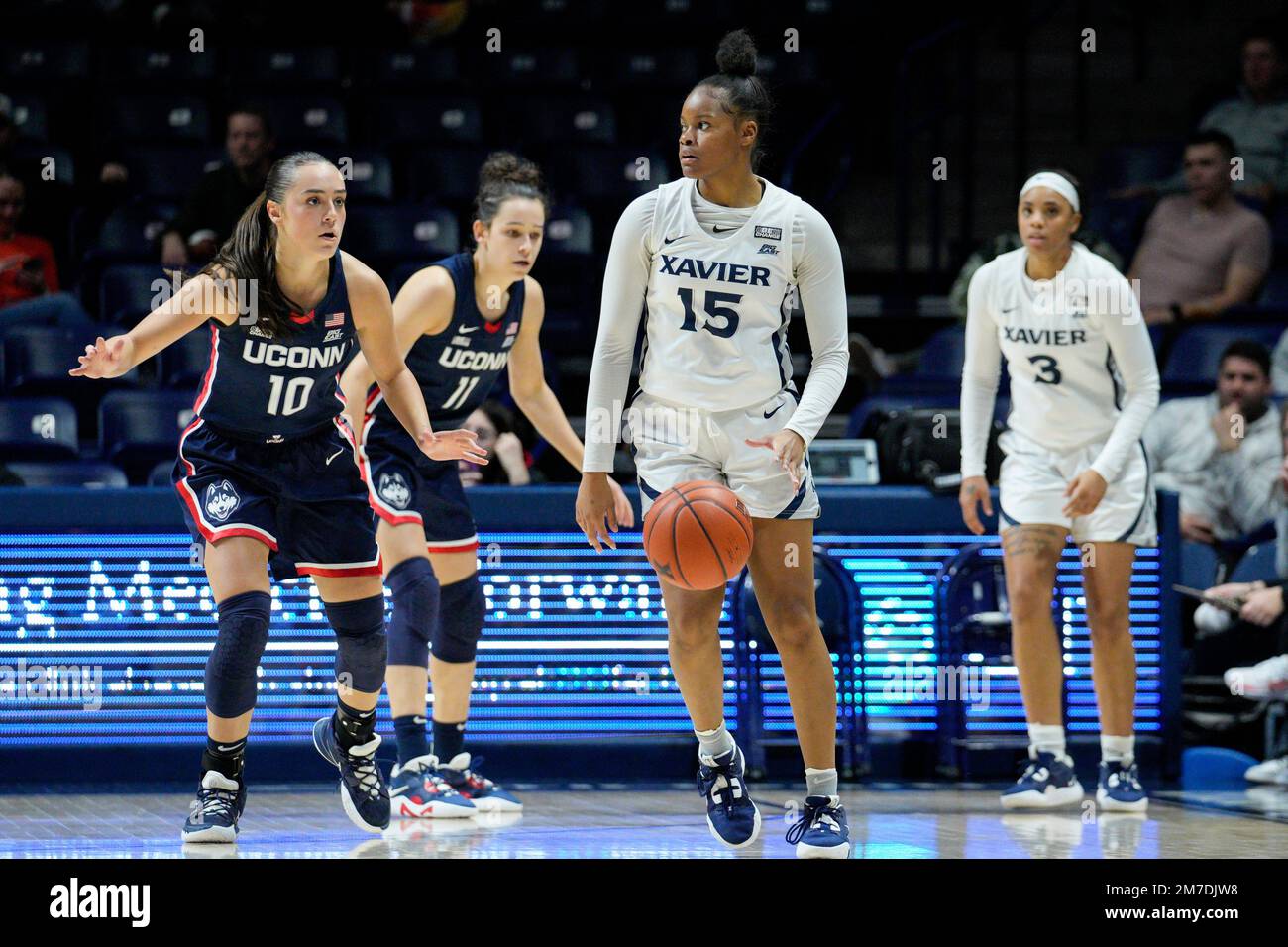 Xavier guard Mackayla Scarlett (15) is guarded by UConn's Nika Muhl (10 ...
