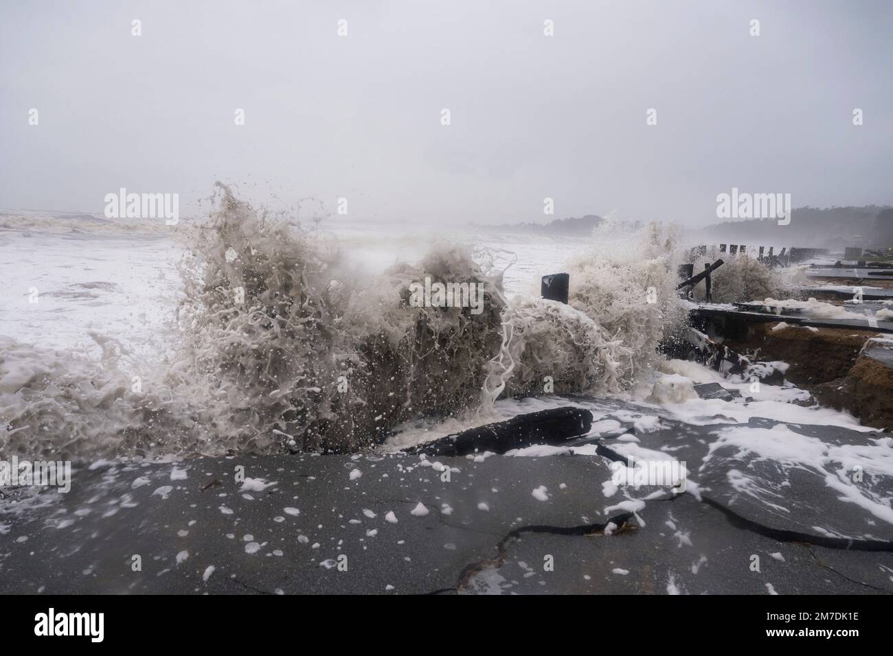Storm waves crash on a damaged section of a parking lot at Seacliff ...