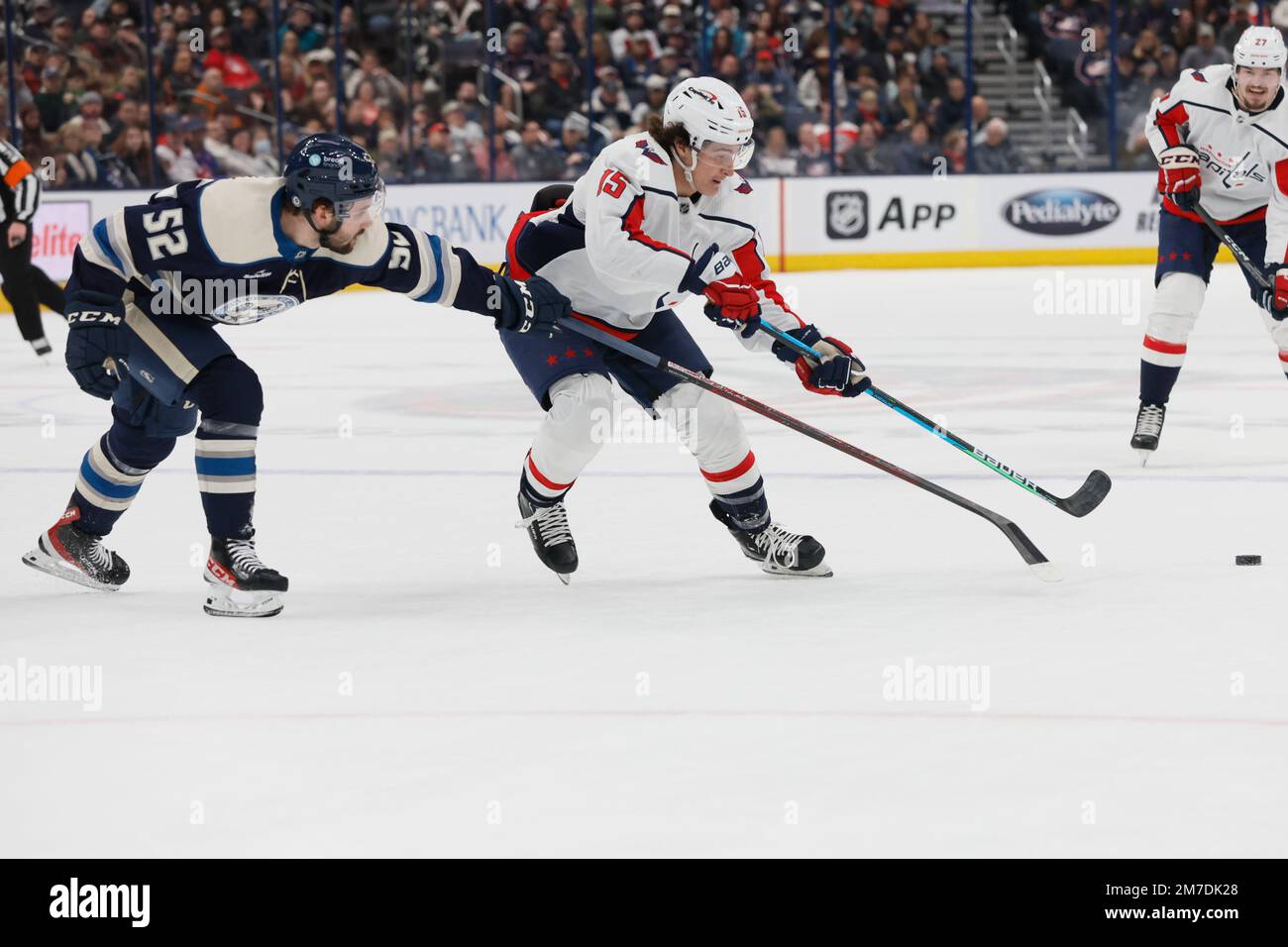 Washington Capitals' Sonny Milano (15) controls the puck as Columbus ...