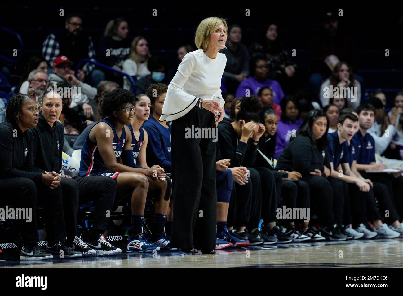 UConn associate head coach Chris Dailey stands next to the bench during ...