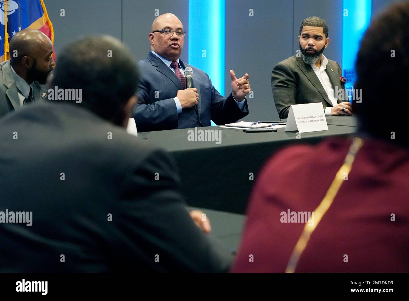 U. S. Marshals Service Director Ronald L. Davis, center, discusses his ...