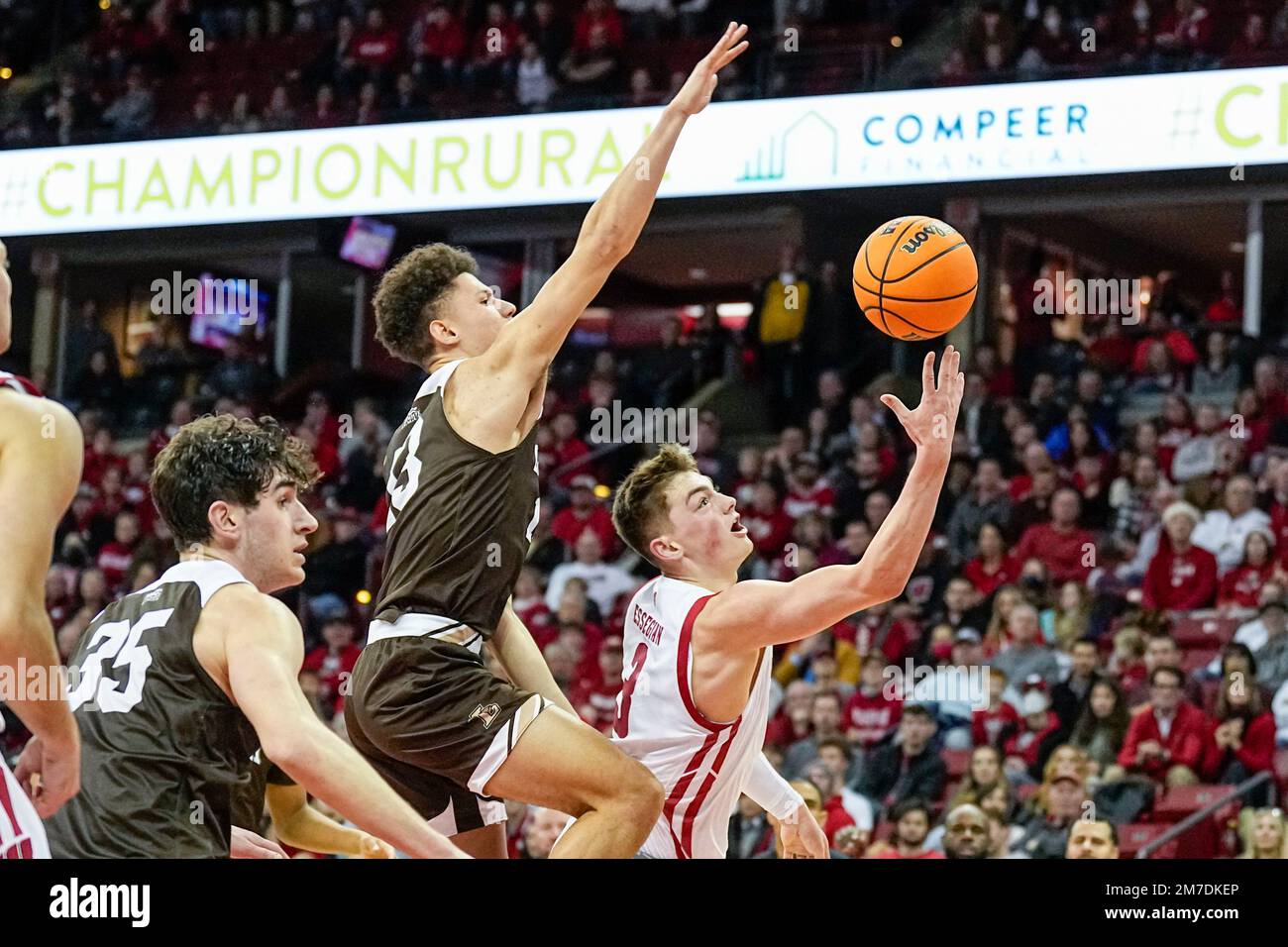 Wisconsin's Connor Essegian (3) shoots against Lehigh's Keith Higgins ...