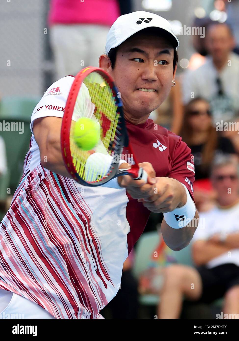 Japan's Yoshihito Nishioka makes a backhand return to Australia's ...