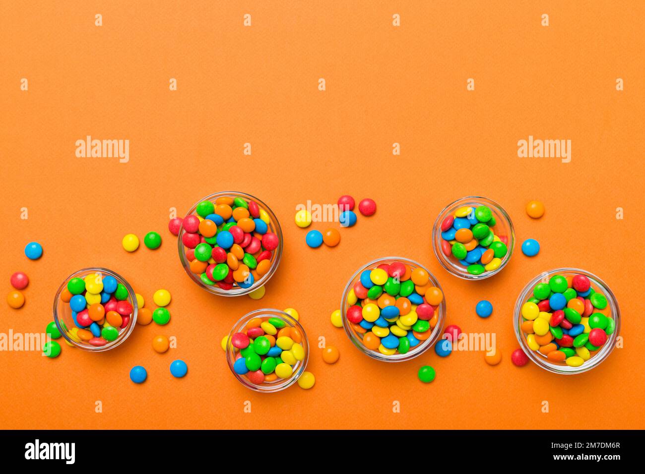 Different Colored Round Candy In Bowl And Jars Top View Of Large Variety Sweets And Candies