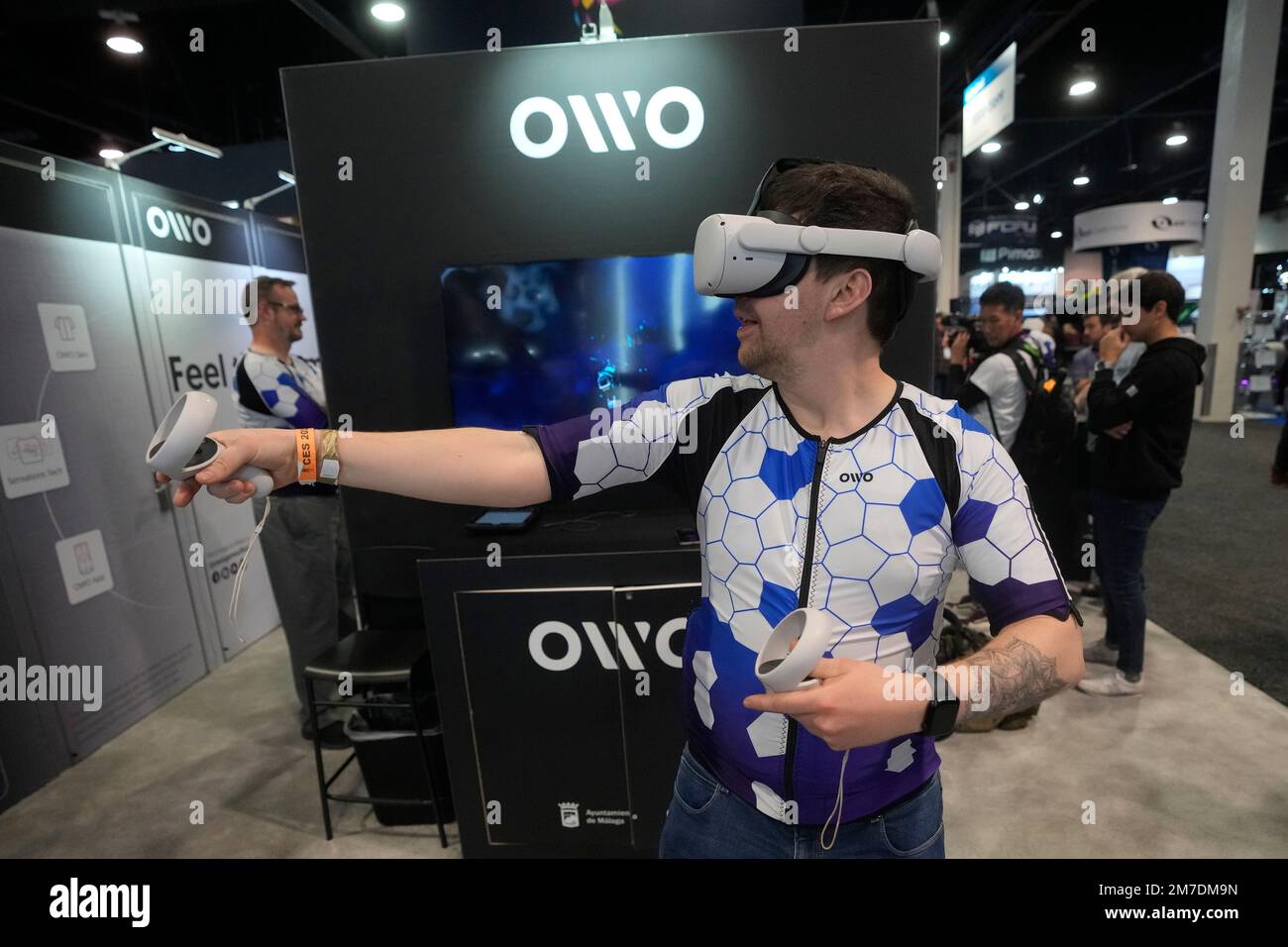 The OWO second skin is worn by a video player at the OWO booth during ...
