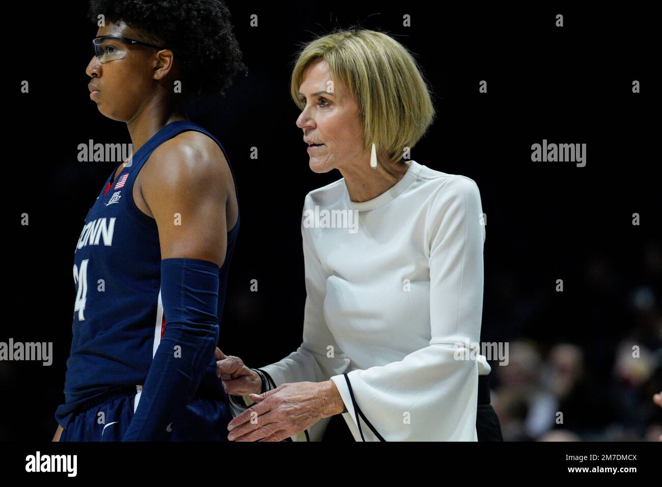 UConn associate head coach Chris Dailey, right, speaks to UConn's ...