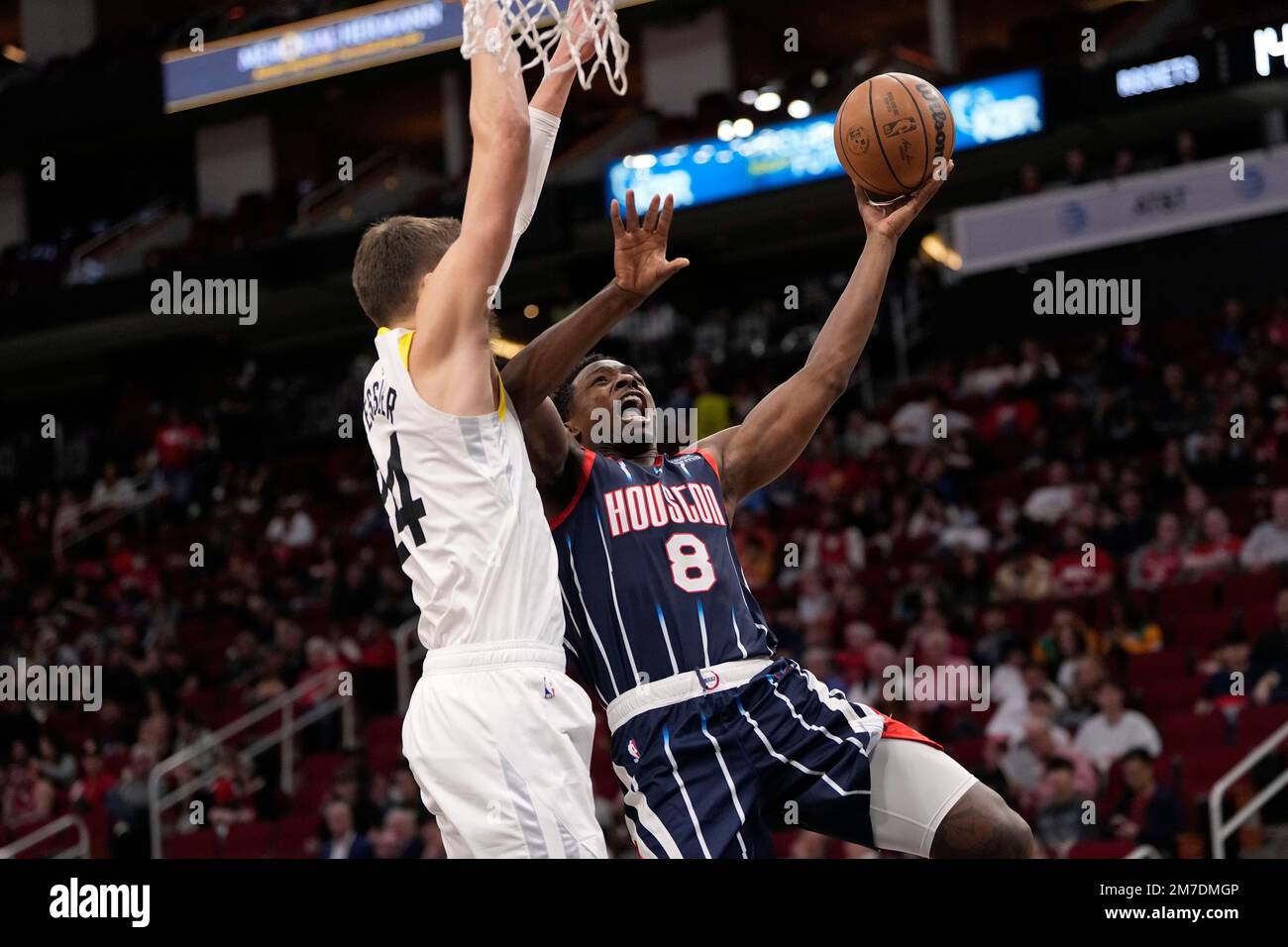 Houston Rockets' Jae'Sean Tate (8) goes up for a shot as Utah Jazz's ...