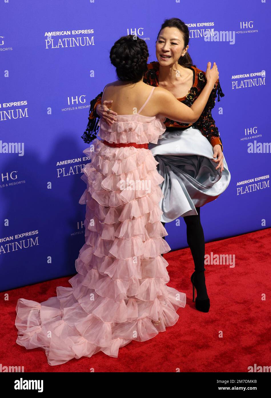 Stephanie Hsu, left, and Michelle Yeoh greet each other as they arrive ...