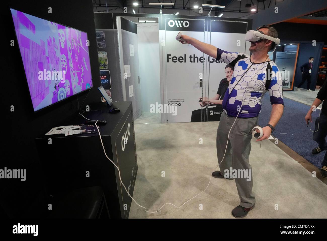 The OWO second skin is worn by a video player at the OWO booth during ...