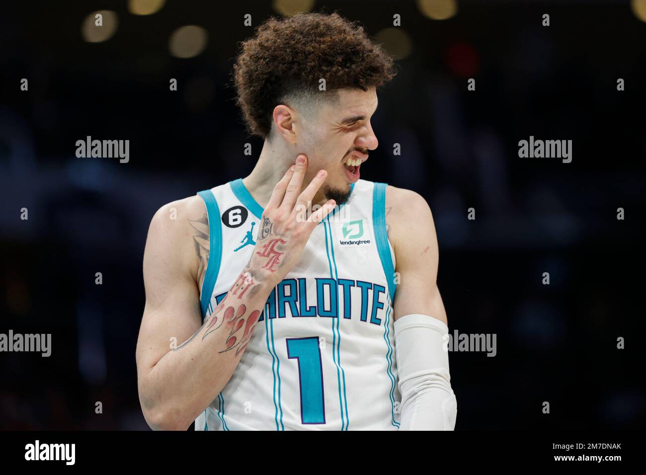 Charlotte Hornets guard LaMelo Ball winces during the second half of an ...